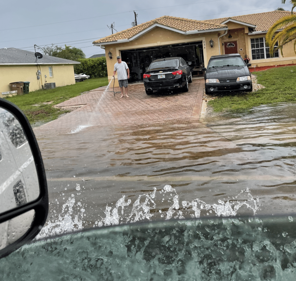 Meme Generator - Man Spraying Water onto flooded street - Newfa Stuff